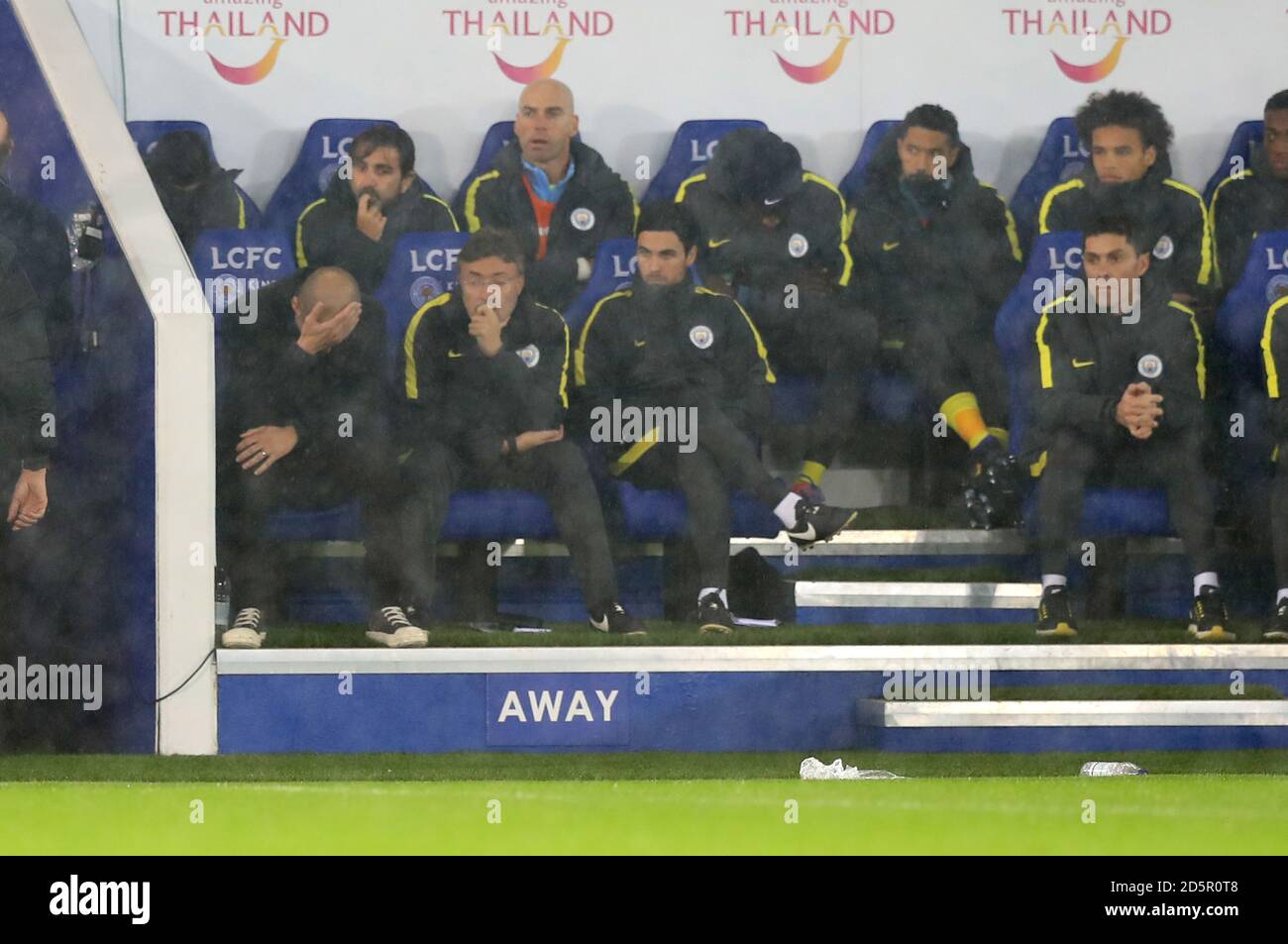 Manchester City manager Pep Guardiola looks on from the bench Stock ...