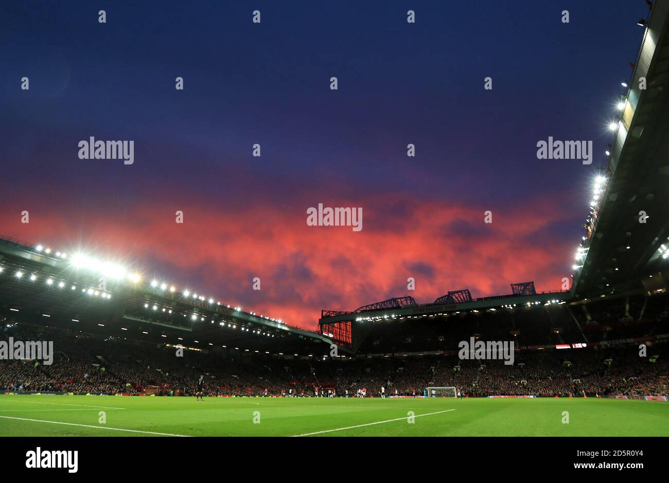 The sunset over Old Trafford towards the end of the game Stock Photo ...