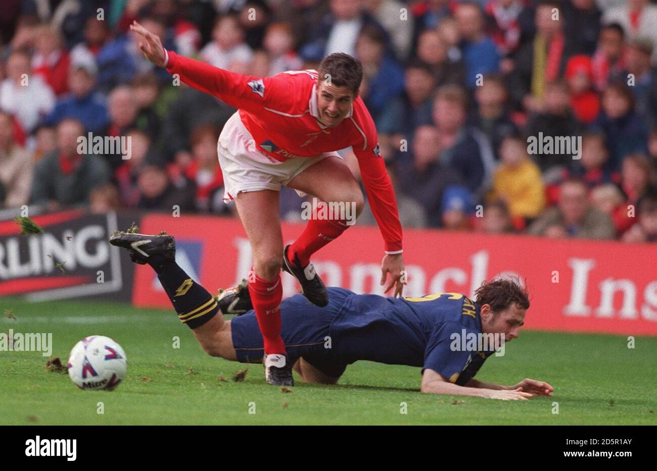 L-R; Andy Gray, Nottingham Forest jumps over the challenge of Ben ...