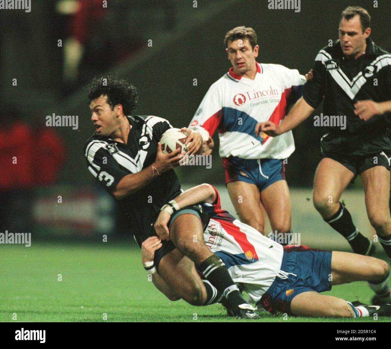 l-r; New Zealand's Kevin Iro is tackled by Great Britain's Andy Farrell ...