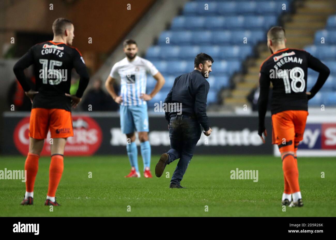 A fan invades the pitch Stock Photo - Alamy