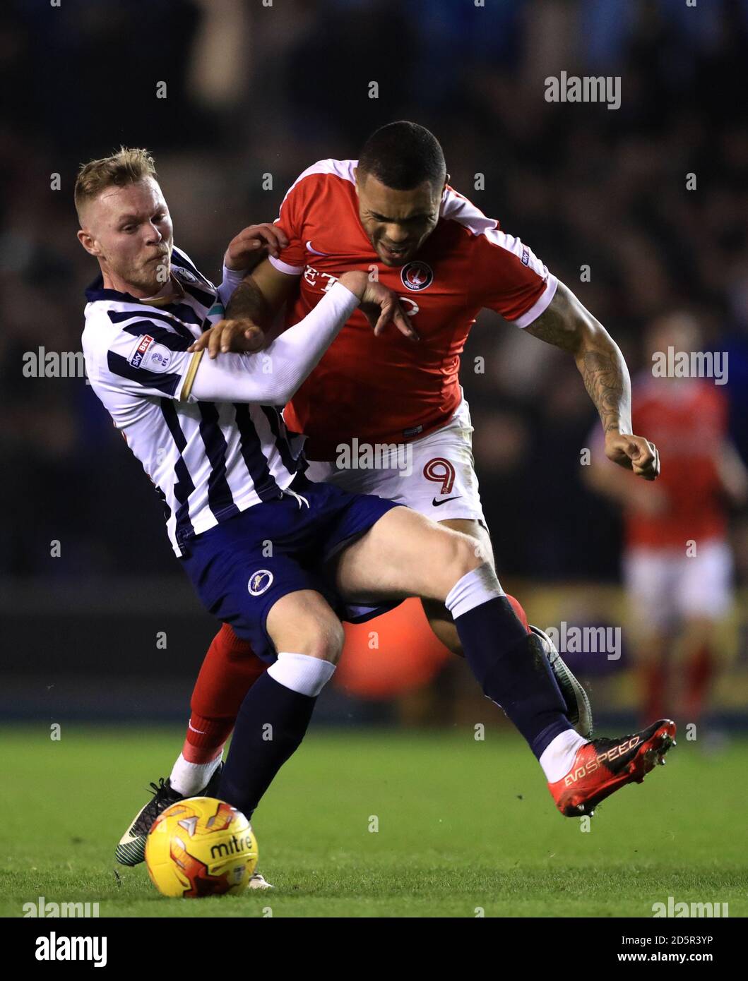 Millwall's Tony Craig , (left) battles for possession of the ball with ...