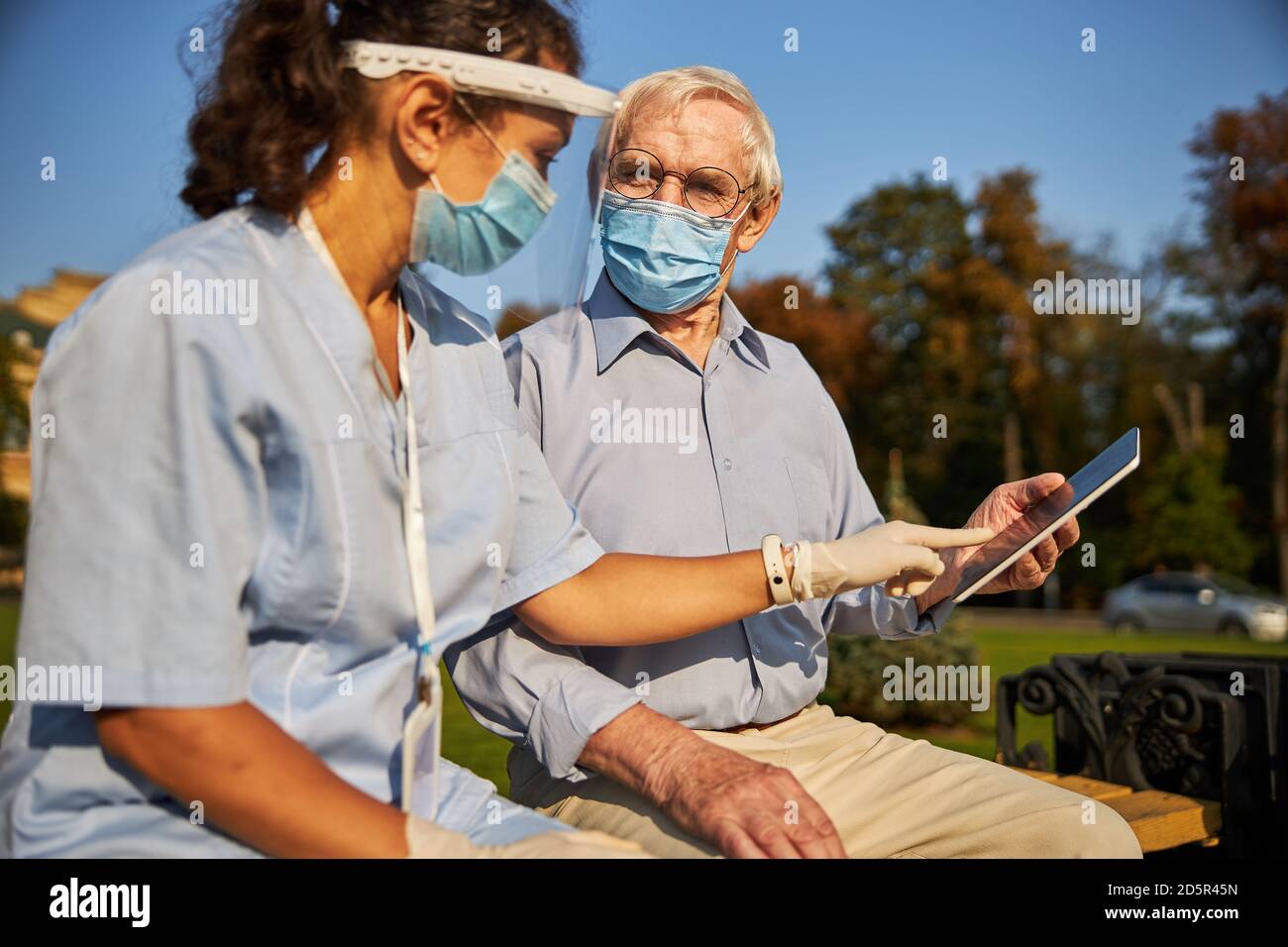Medical doctor sitting on bench hi-res stock photography and images - Alamy