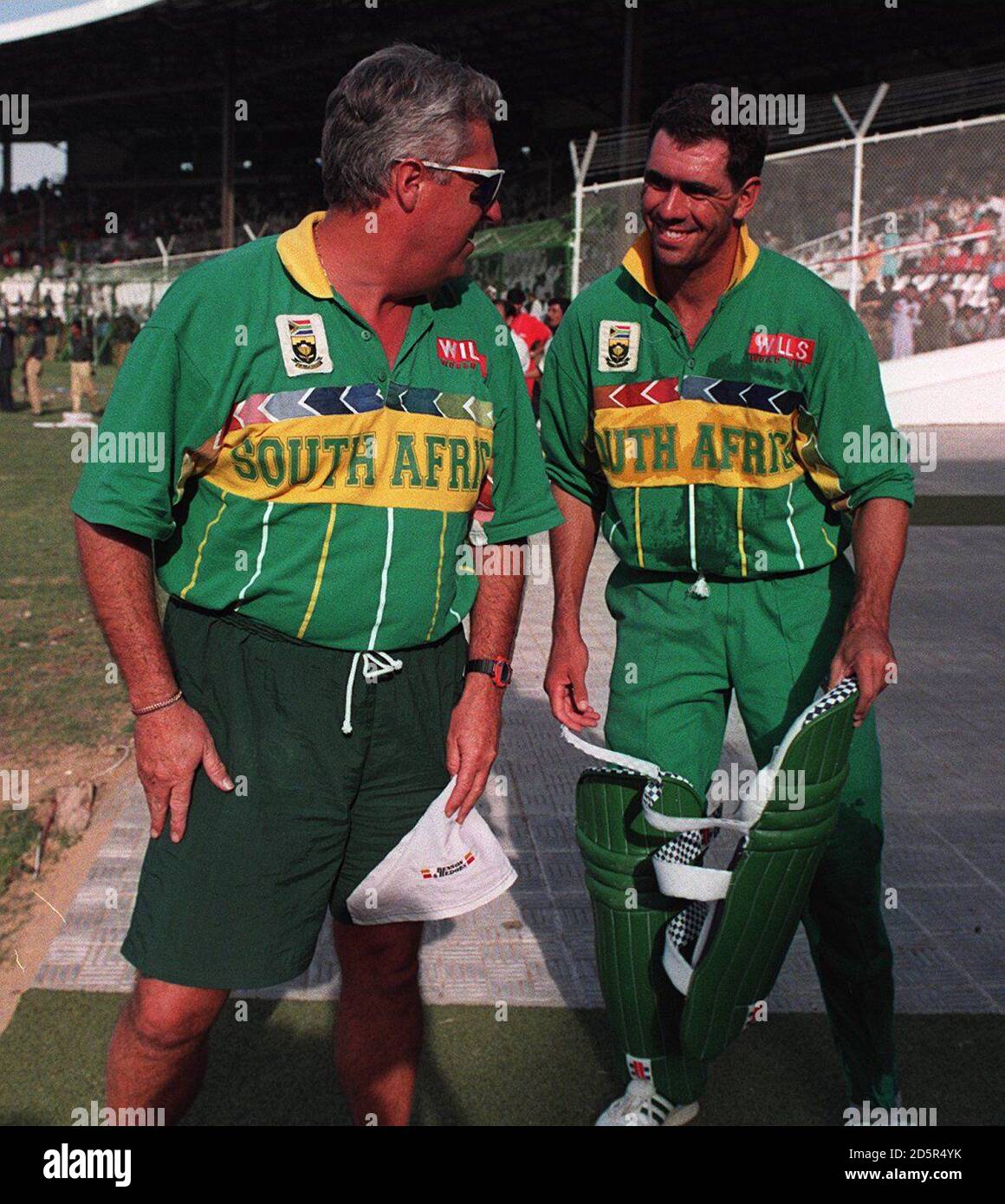 South Africa coach Bob Woolmer (left) congratulates captain Hansie ...