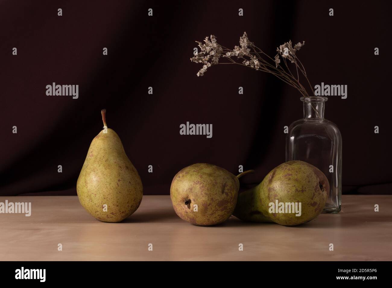 Closeup of fruits on the dark background, still life of pears, and a ...