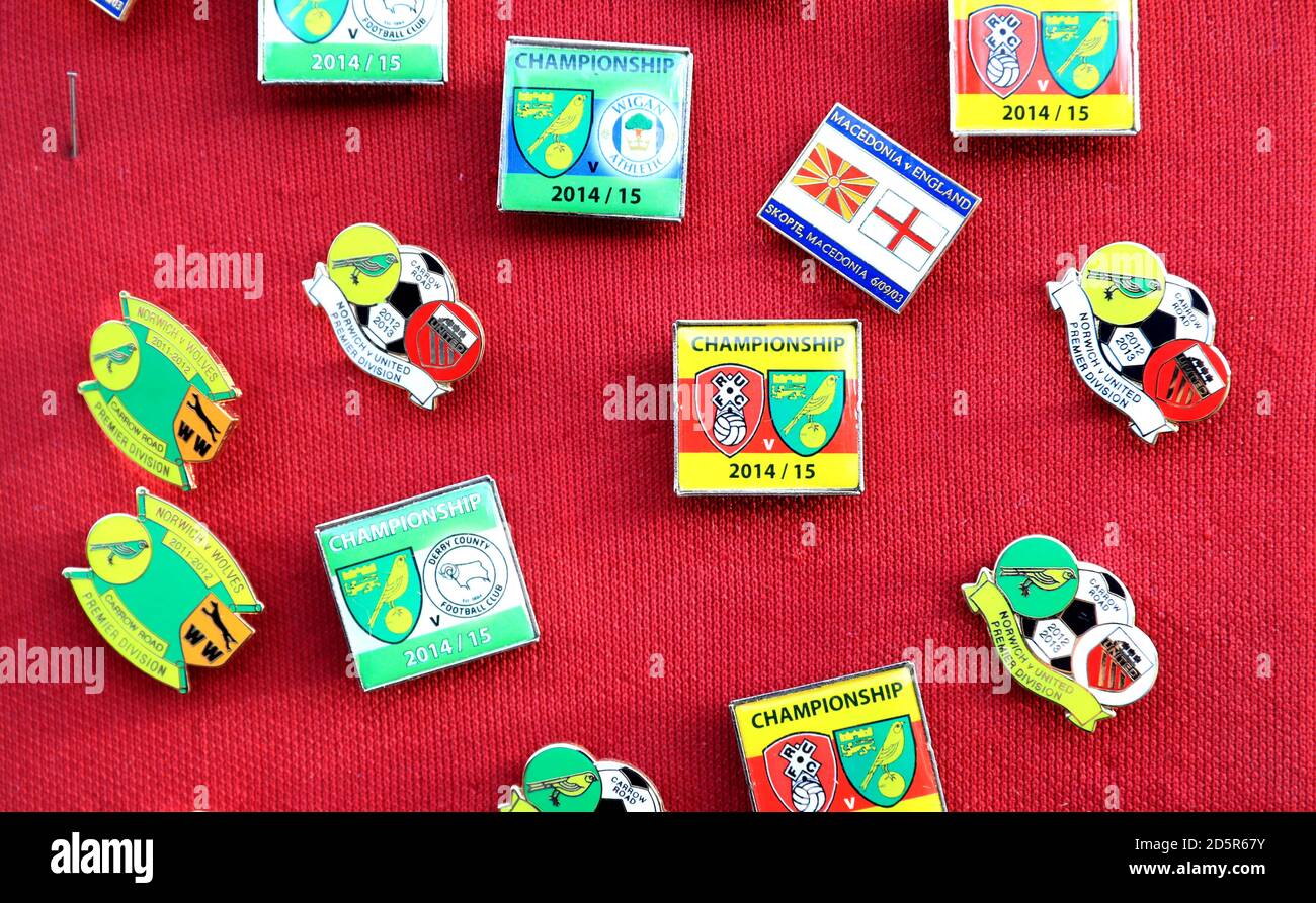 Norwich City pins and badges on sale before the game Stock Photo - Alamy