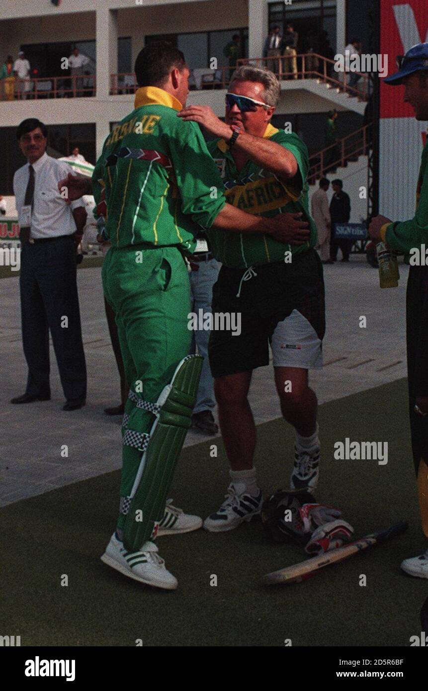 South Africa coach Bob Woolmer (right) congratulates captain Hansie ...