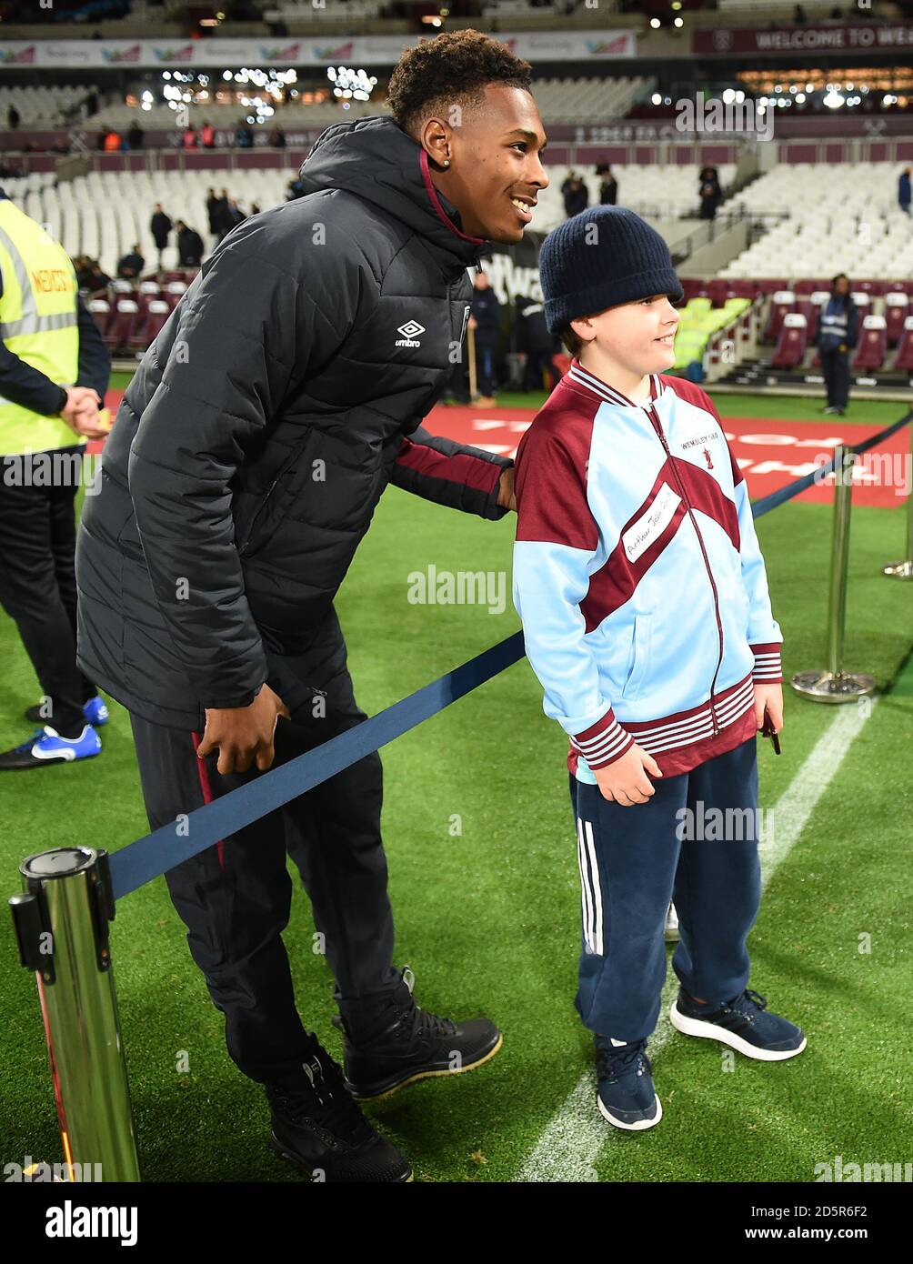 West Ham United's Reece Oxford poses for a photograph with a fan before ...