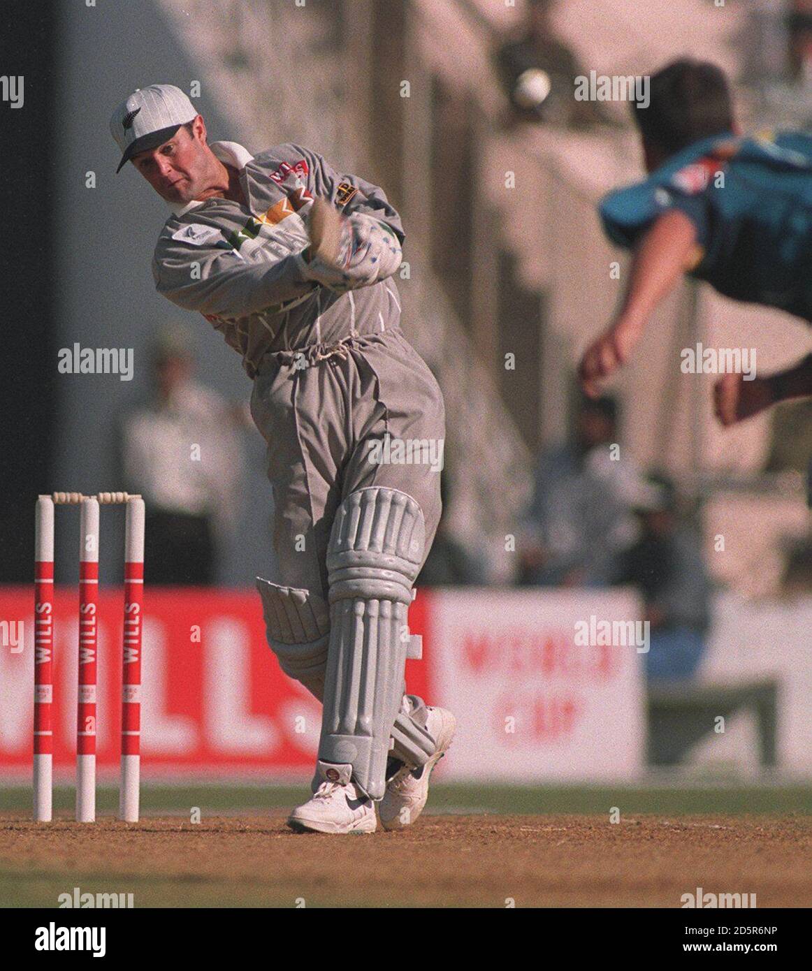 New Zealand's Nathan Astle (left) hits England's Darren Gough (right ...