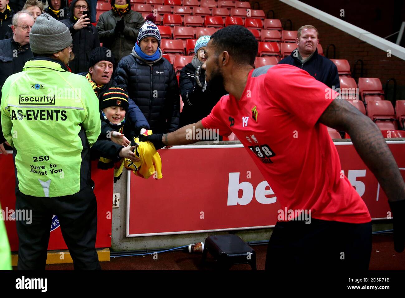 Watford's Jerome Sinclair hands his jersey to a young fan after the ...