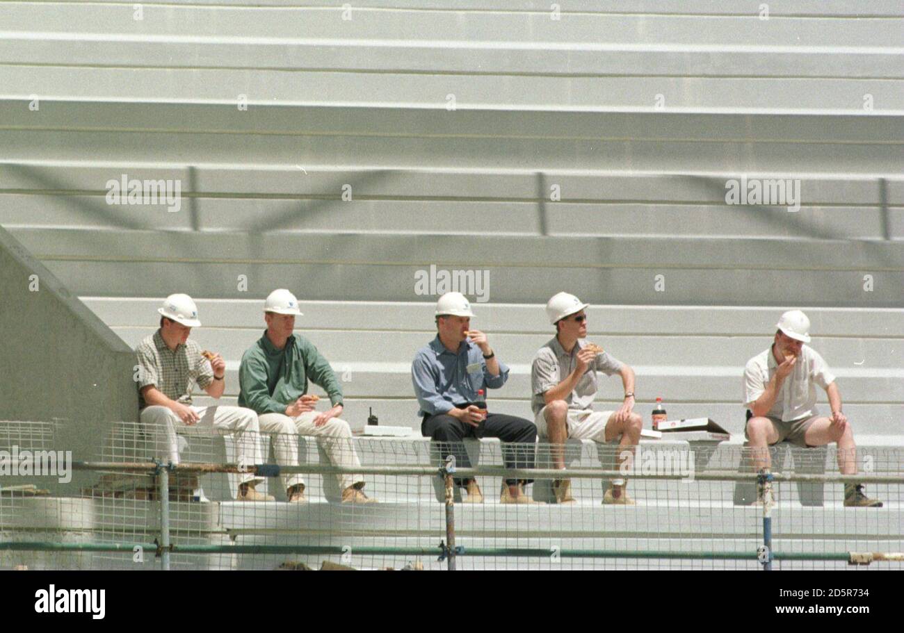 Construction workers building a new grandstand at the Gabba take time ...
