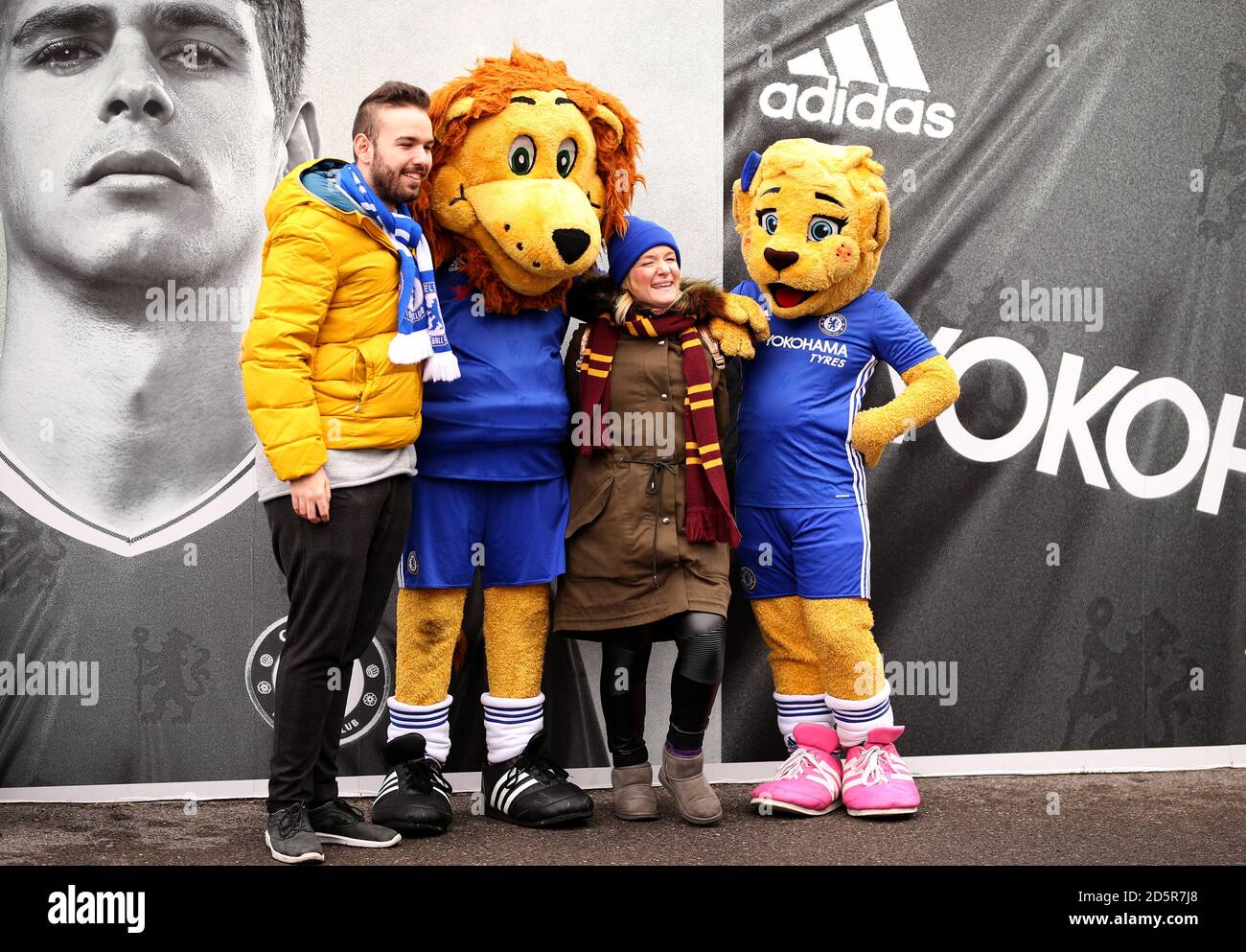 Fans pose for photographs with Chelsea mascots Stamford the Lion and ...