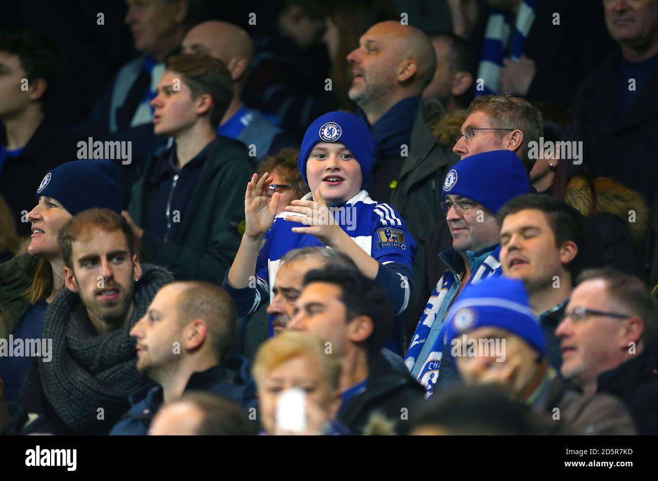 A young Chelsea fan cheers on his side from the stands Stock Photo - Alamy