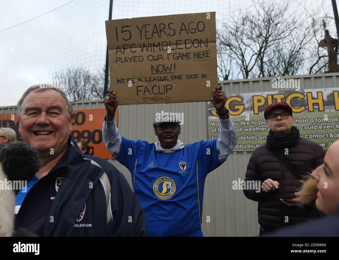 An AFC Wimbledon fan with a sign Stock Photo - Alamy