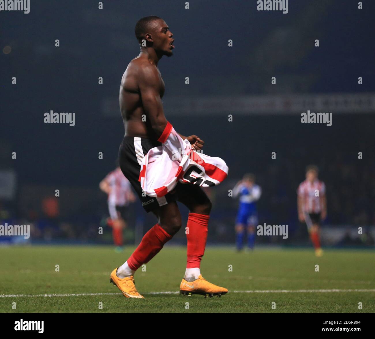 Lincoln City's Theo Robinson celebrates scoring his side's second goal ...