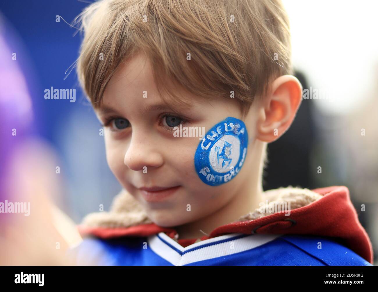 A Chelsea fan with his face paint ahead of the match Stock Photo - Alamy