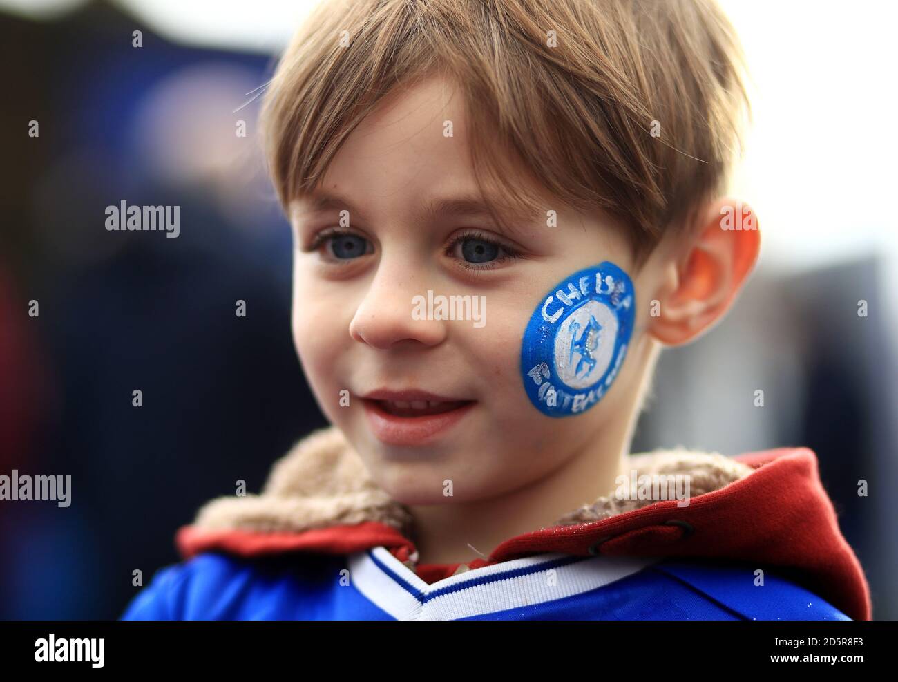 A Chelsea fan with his face paint ahead of the match Stock Photo - Alamy