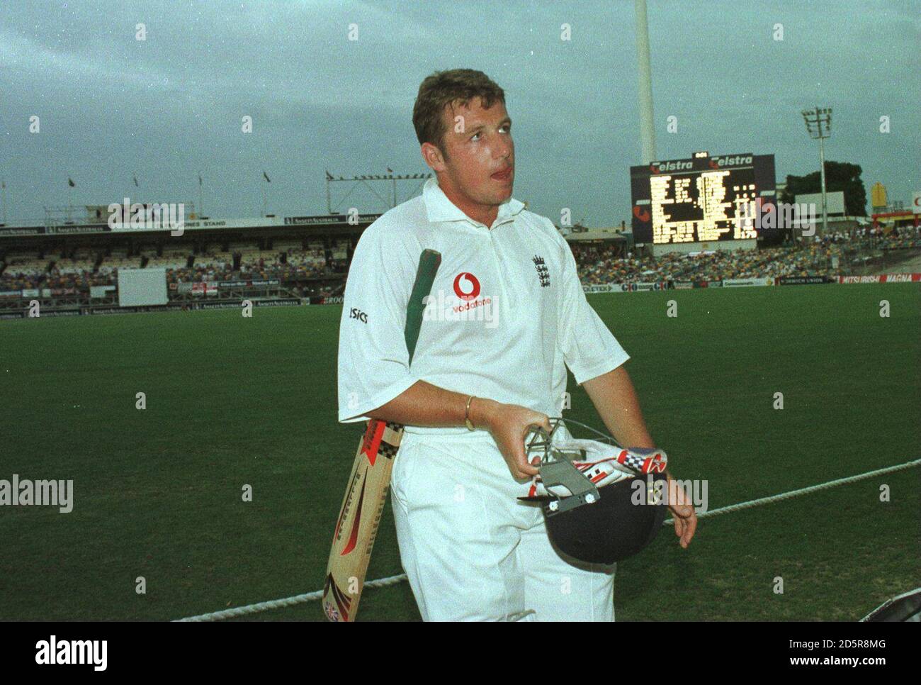 England's Robert Croft leaves the Gabba after bad light stopped play in ...