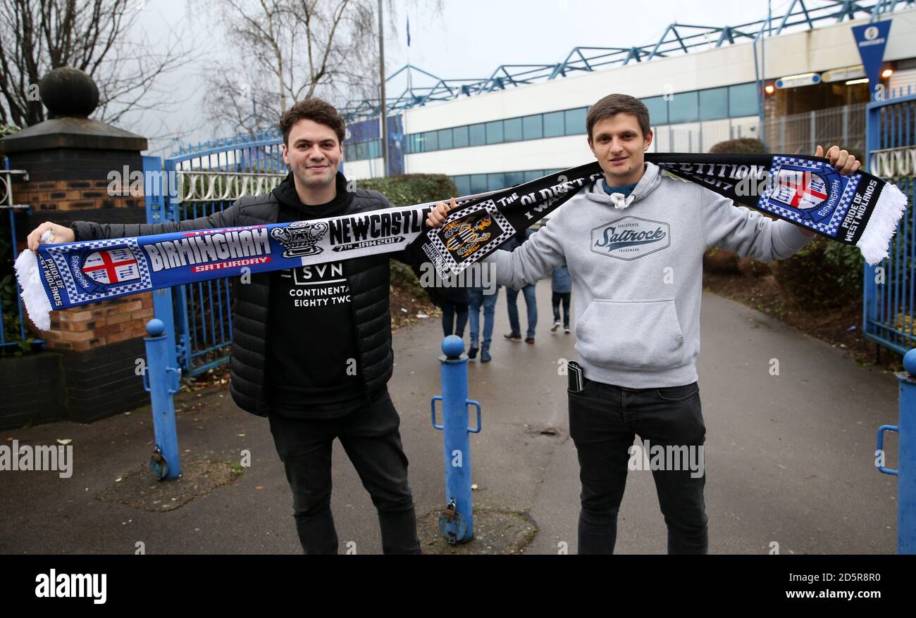Fans outside the stadium hold up half and half scarves Stock Photo - Alamy