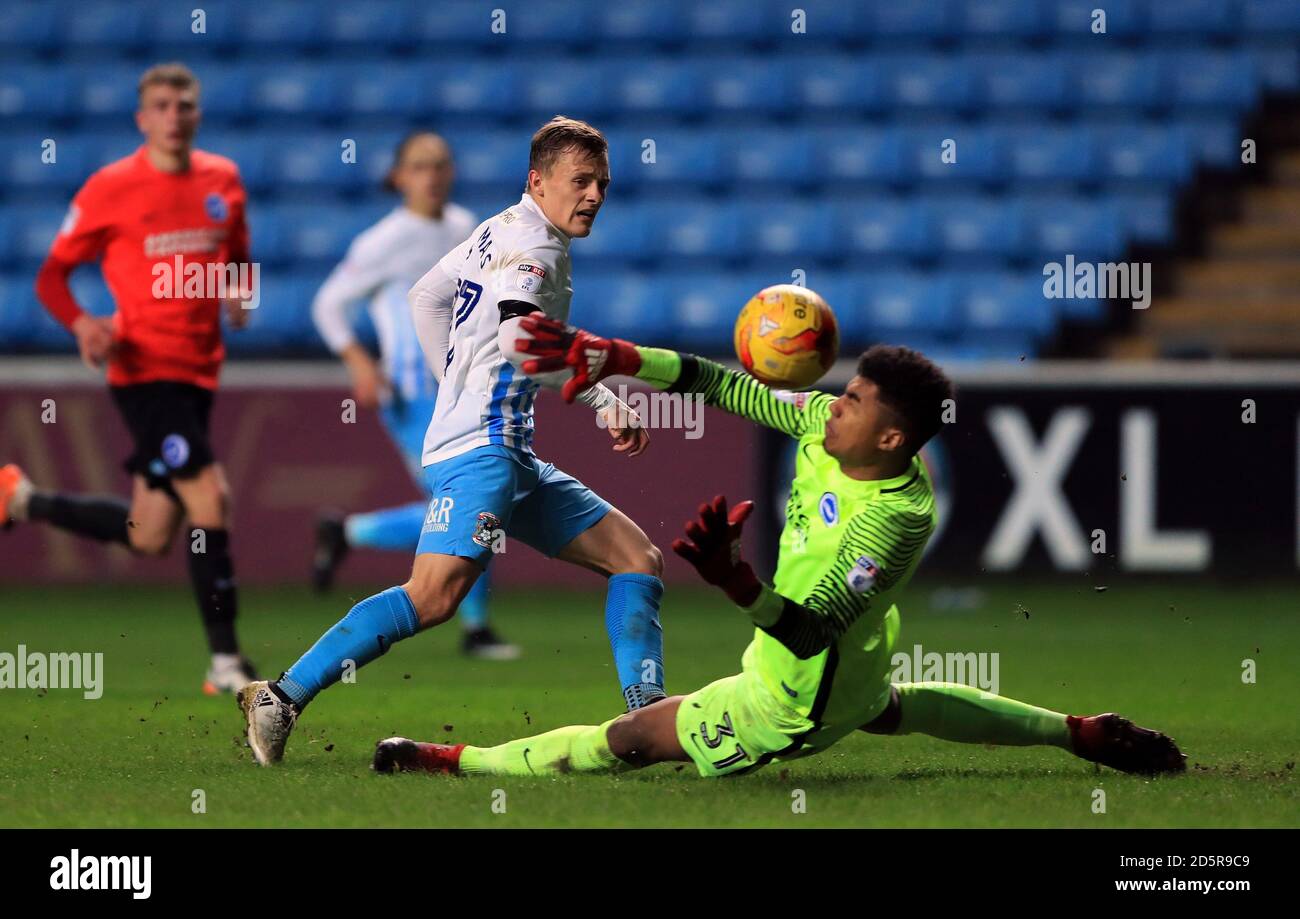 Coventry City's George Thomas has a shot past Brighton and Hove Albion ...