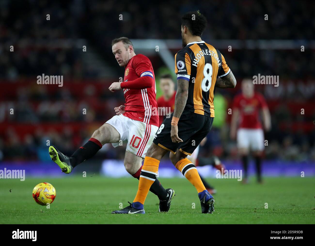 Manchester United's Wayne Rooney (left) and Hull City's Tom Huddlestone ...
