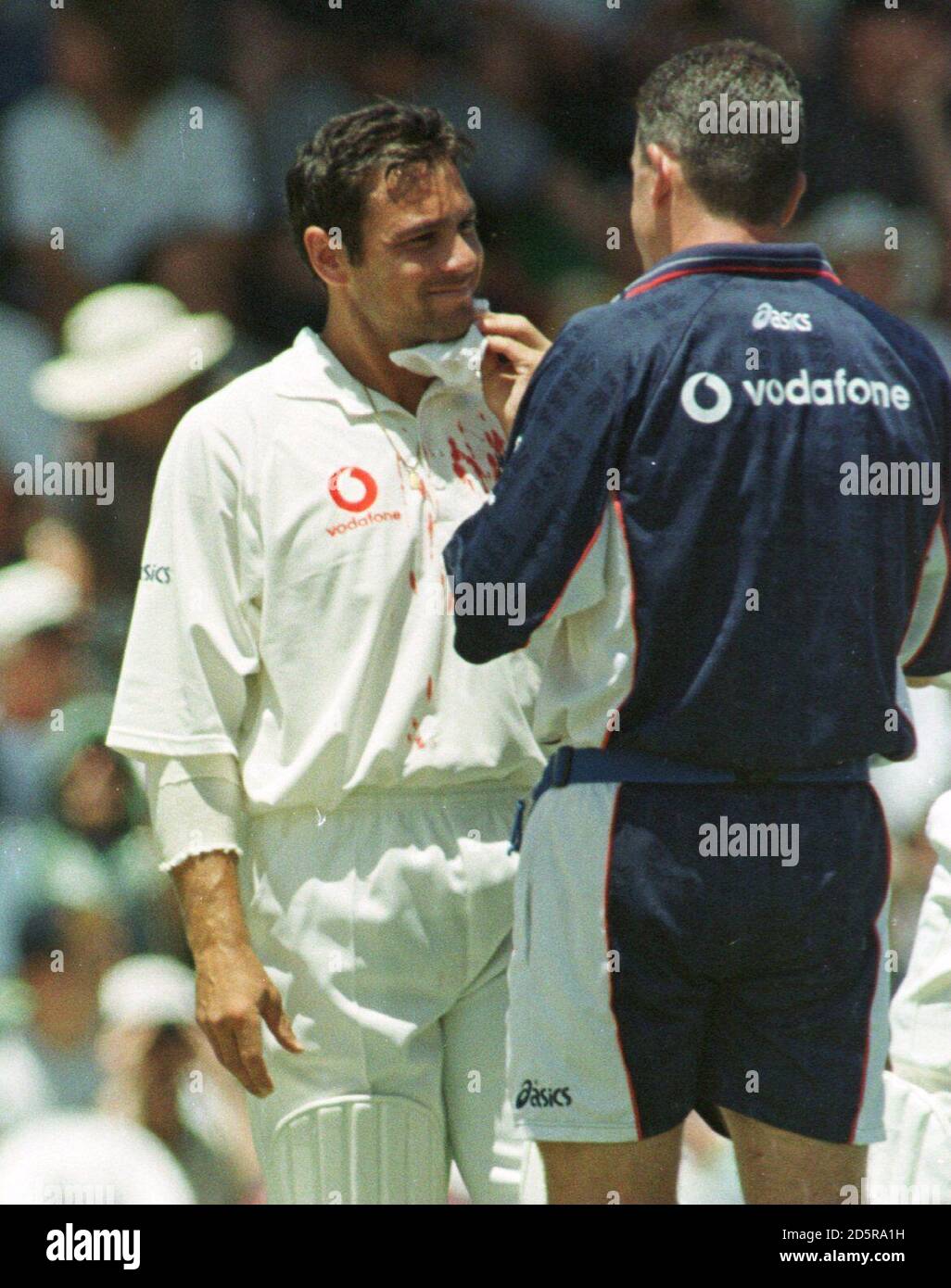 England's Mark Ramprakash receives treatment from physio Wayne Morton ...