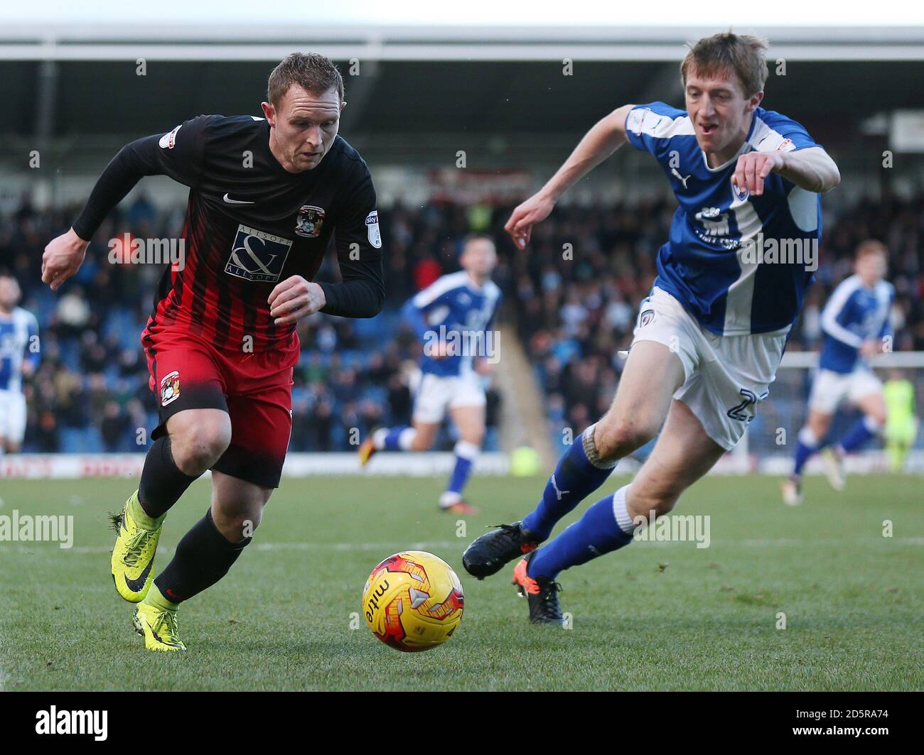Coventry City's Stuart Beavon (left) in action with Chesterfield's Tom ...