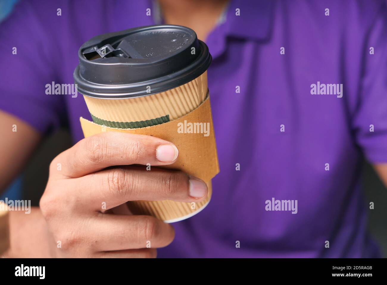 hand holding reusable eco coffee cup close up Stock Photo - Alamy