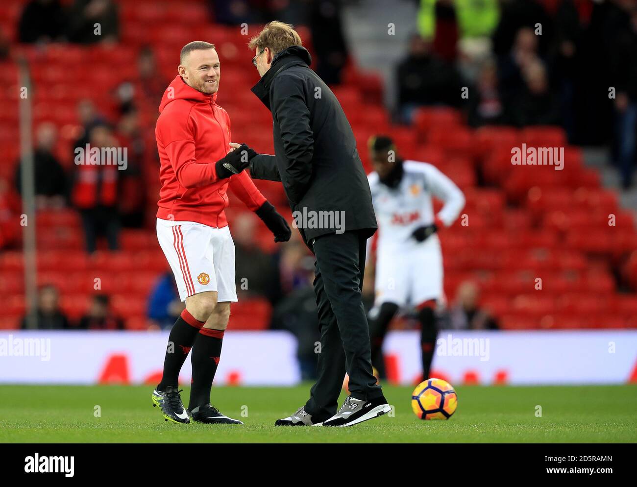 Manchester United's Wayne Rooney (left) with Liverpool manager Jurgen ...