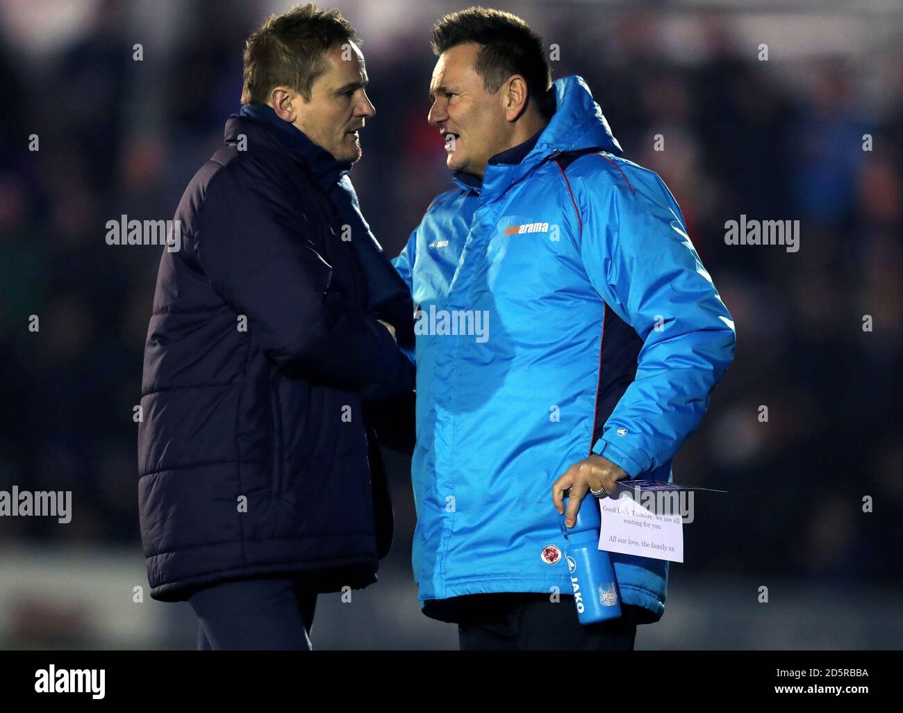 AFC Wimbledon manager Neal Ardley (left) shakes hands with Sutton ...
