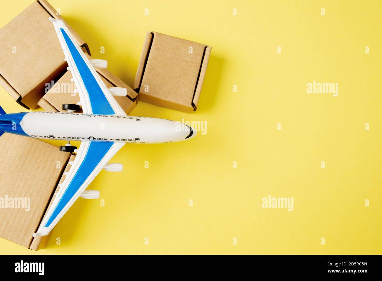 Airplane and stack of cardboard boxes. concept of air cargo and parcels ...