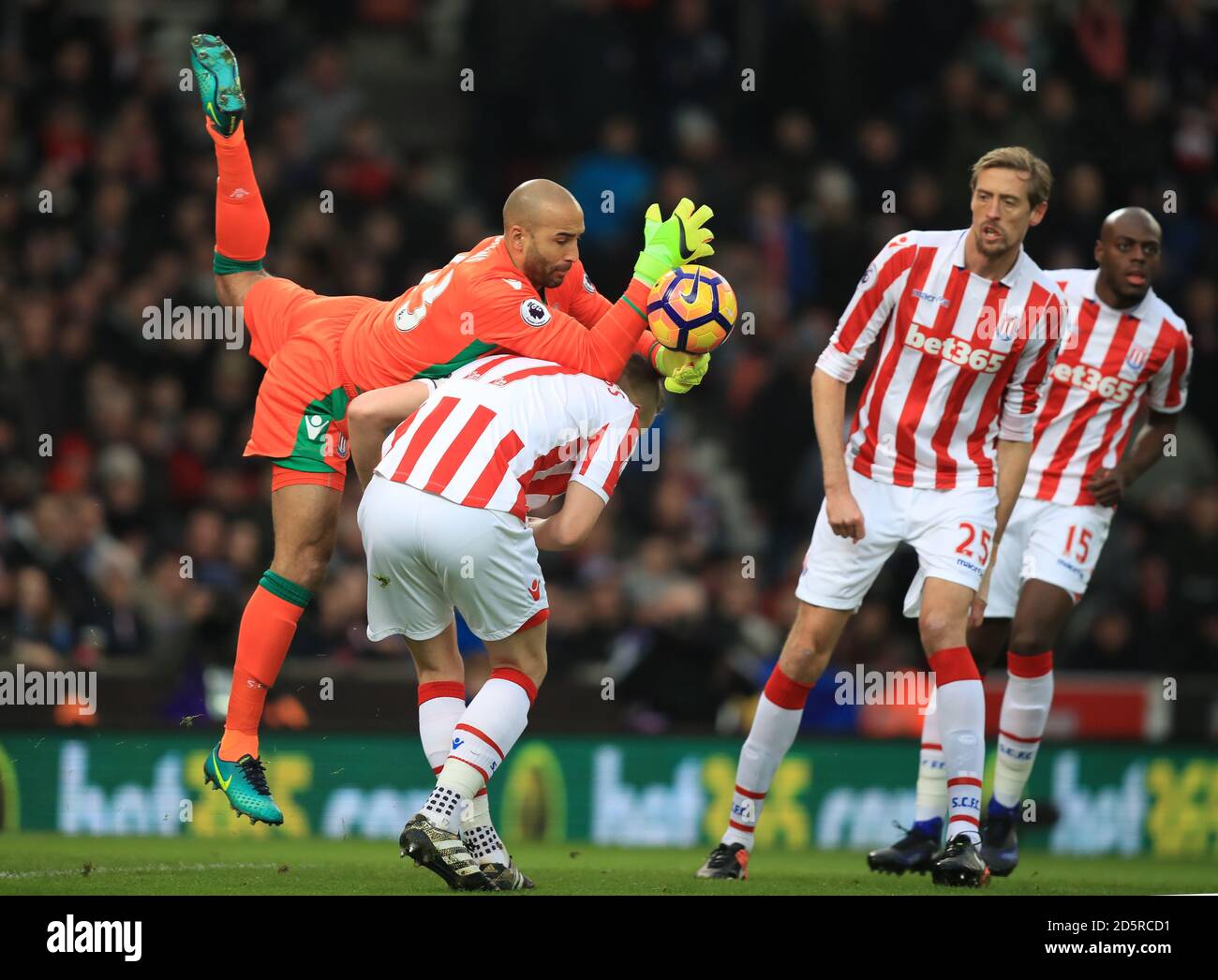 Stoke City's keeper Lee Grant collides with teammate Ryan Shawcross ...