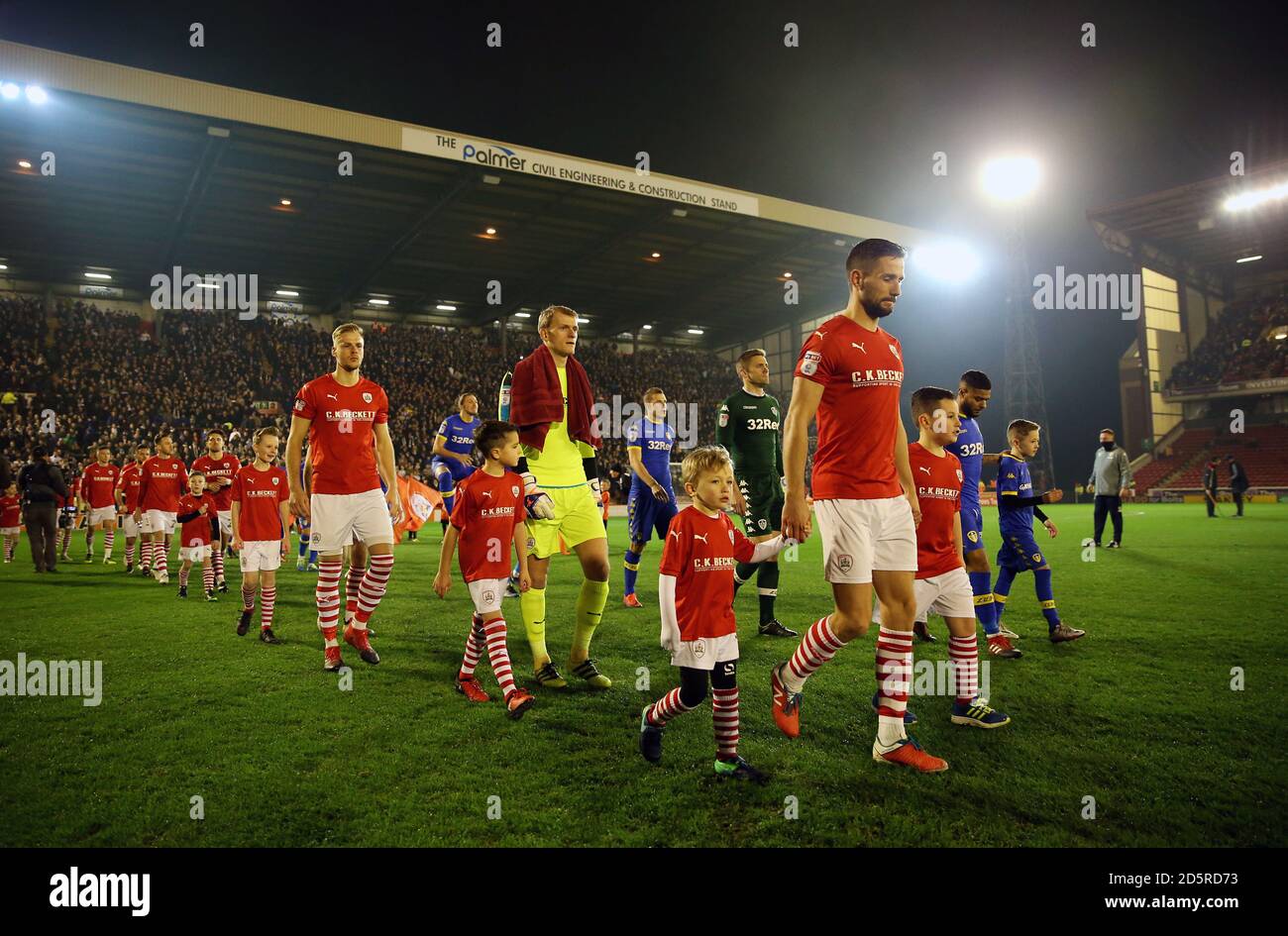 Barnsley players and mascots head out onto the pitch Stock Photo - Alamy