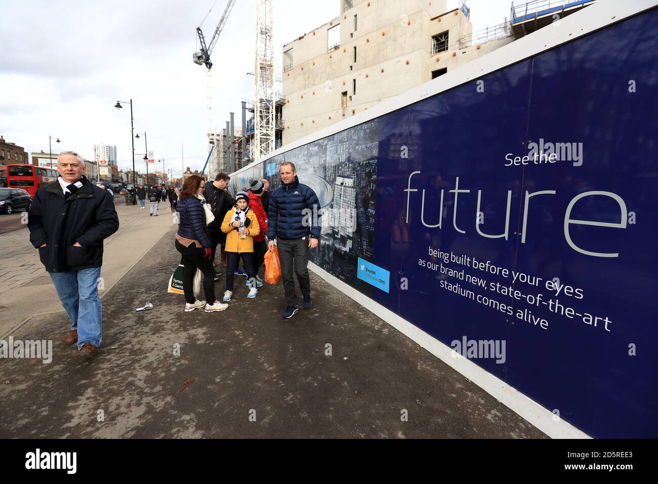 Football fans walk past building works for the new ground Stock Photo ...