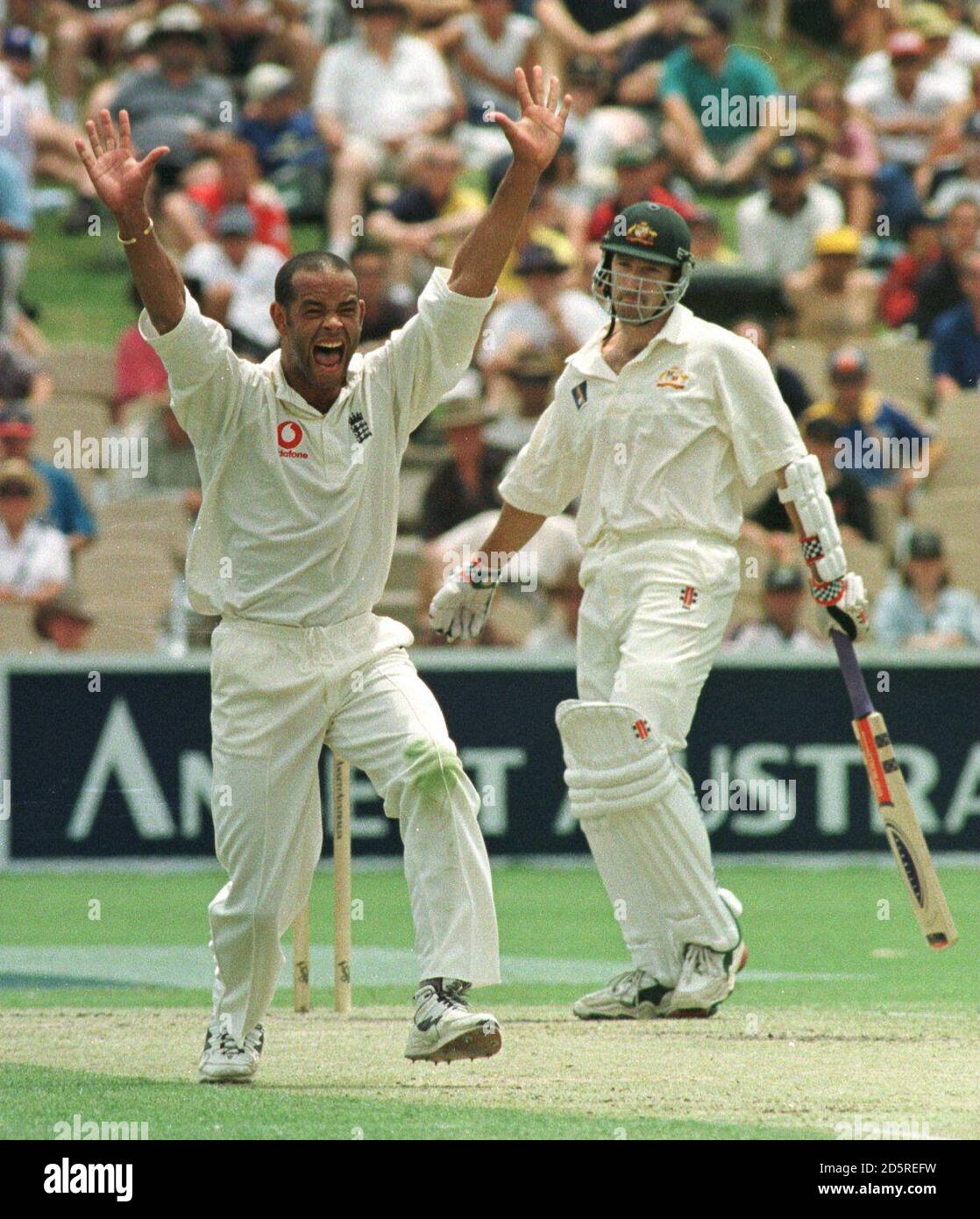 England's Dean Headley claims the wicket of Australia's Damien Fleming ...
