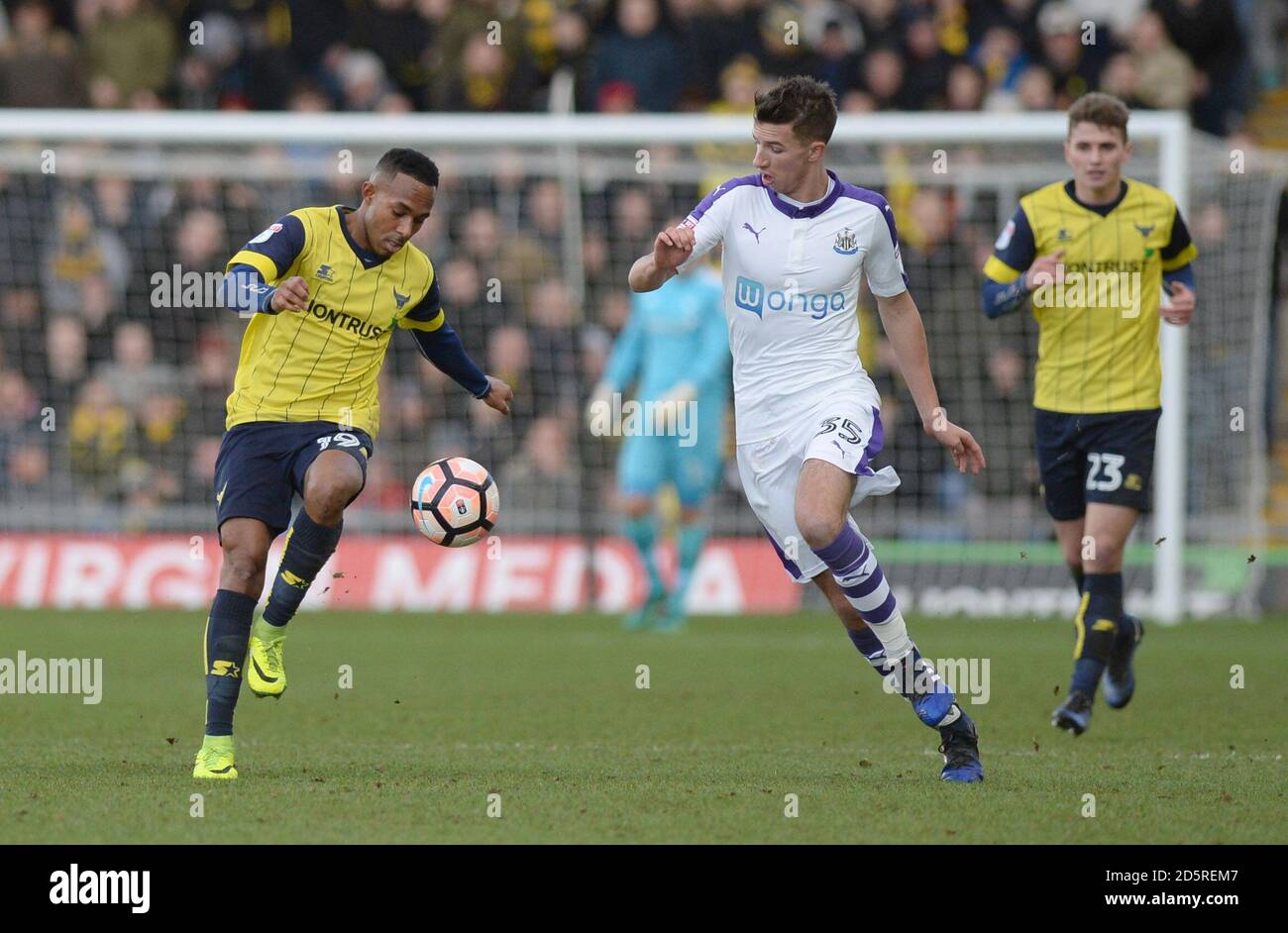 Oxford United's Rob Hall (left) and Newcastle United's Daniel Barlaser ...