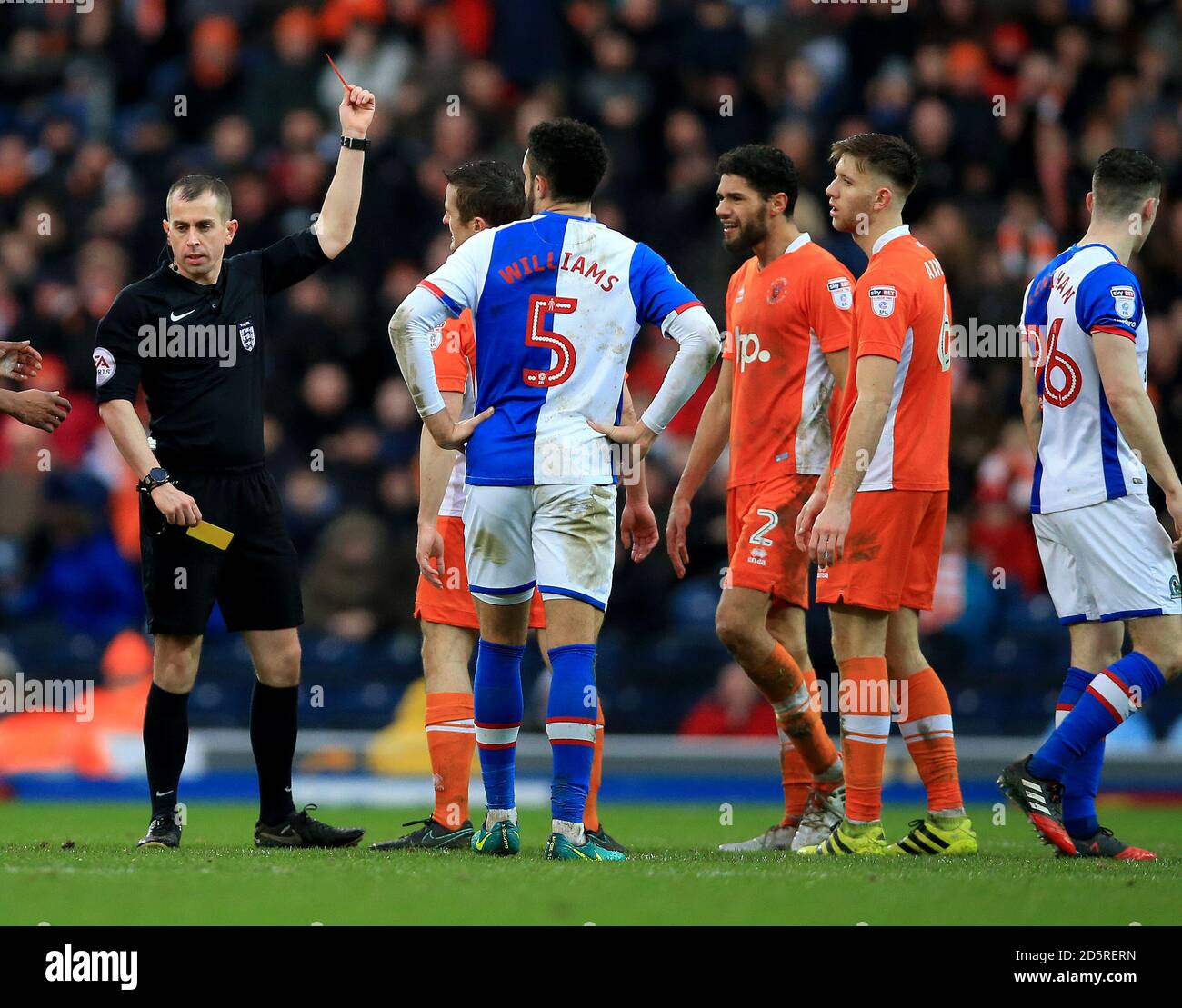 Blackpool's Kelvin Mellor (Third right) is shown a red card by referee ...