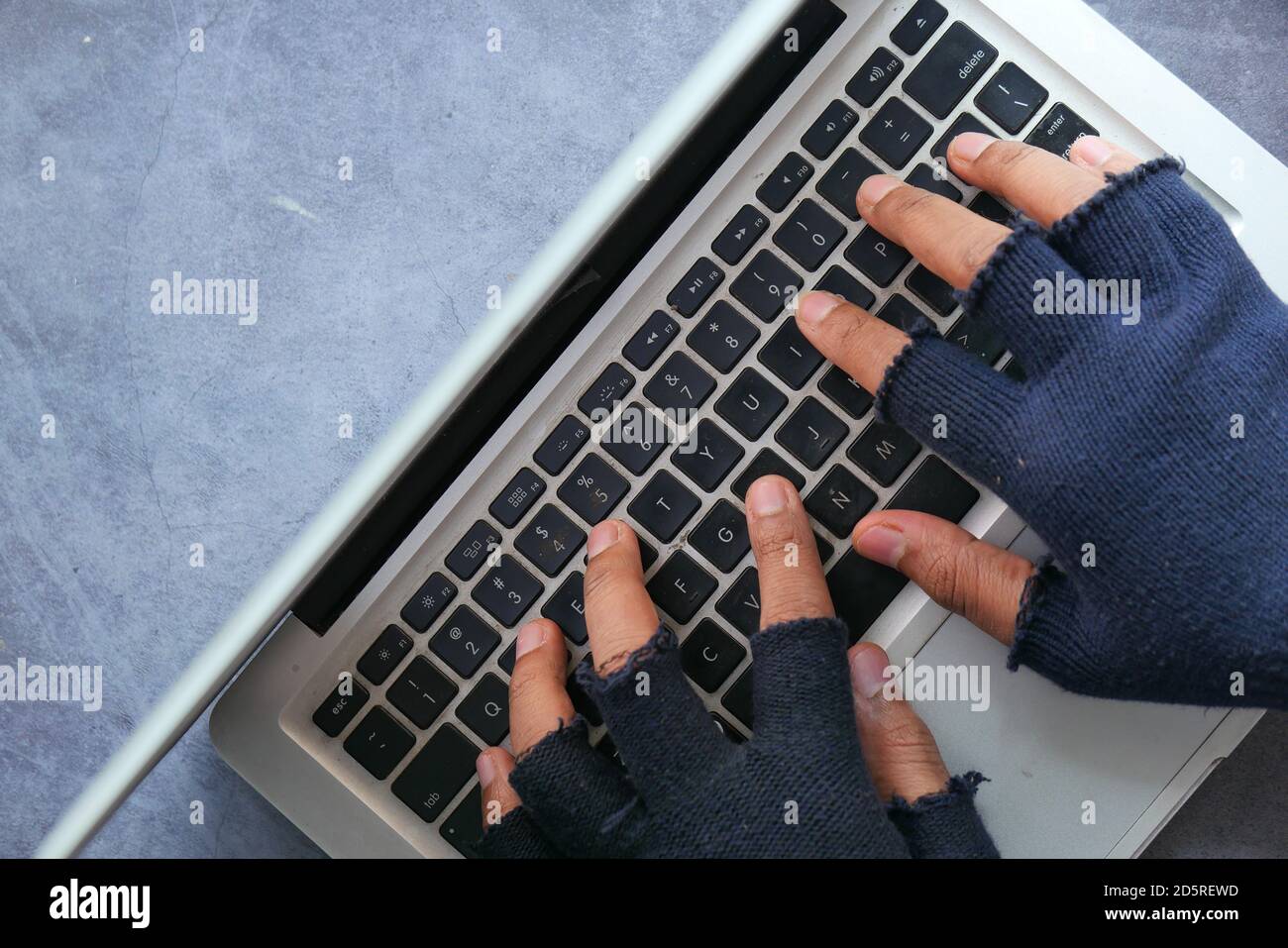 hacker hand stealing data from laptop top down Stock Photo - Alamy
