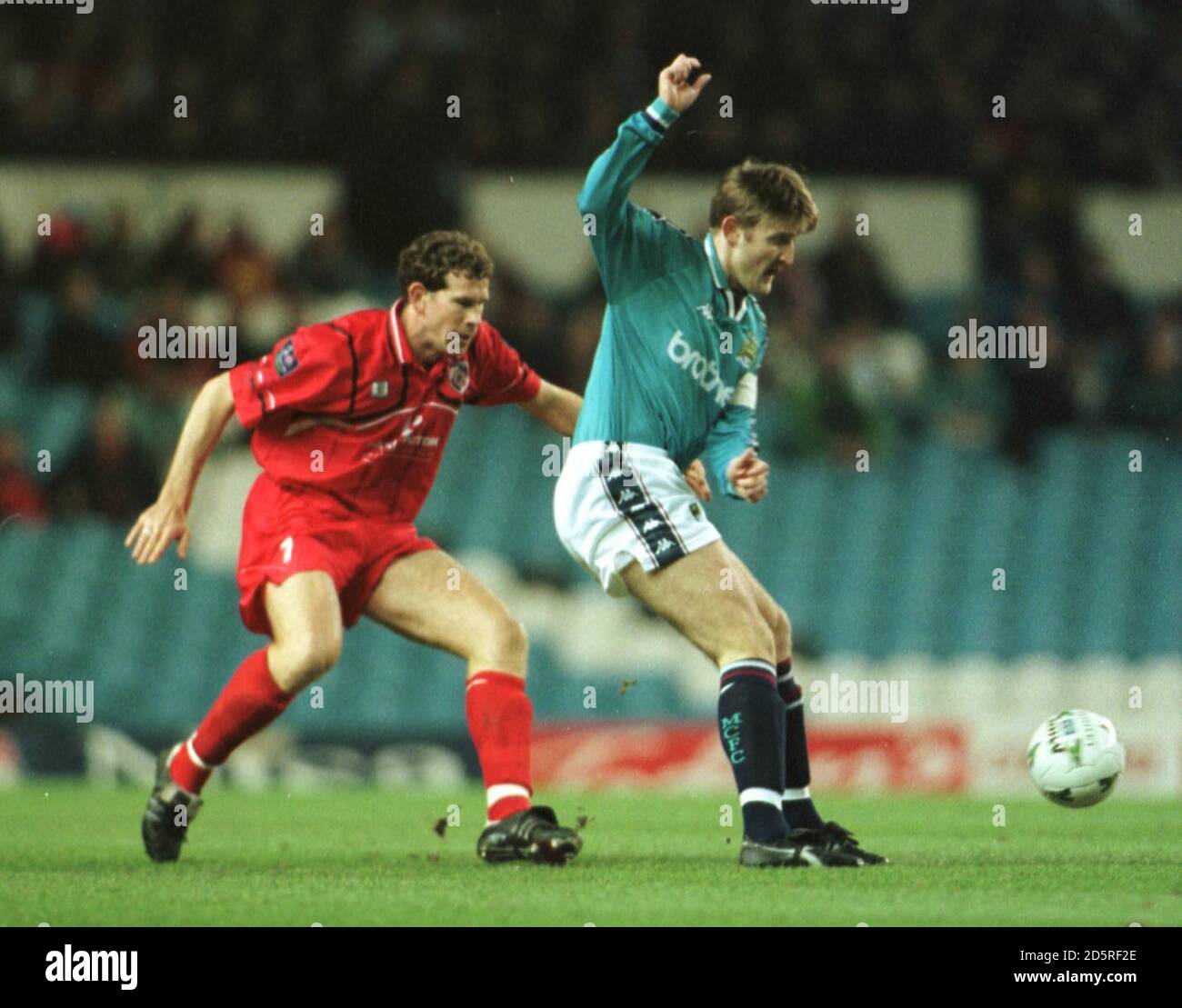 Manchester City's Jamie Pollock battle with Darlington's Steve Gaughan ...