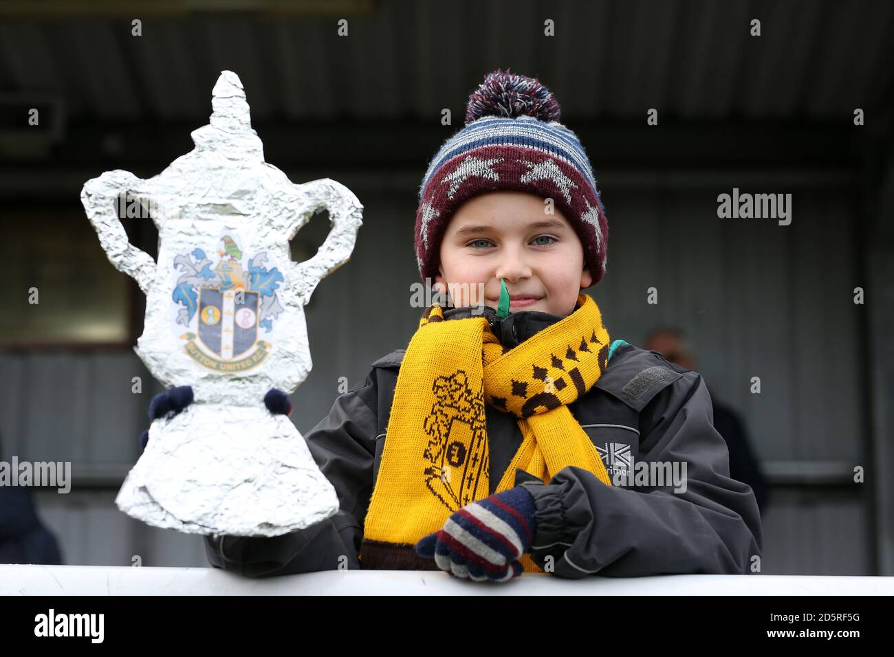 General view of a Sutton United fan with a replica FA Cup trophy before ...
