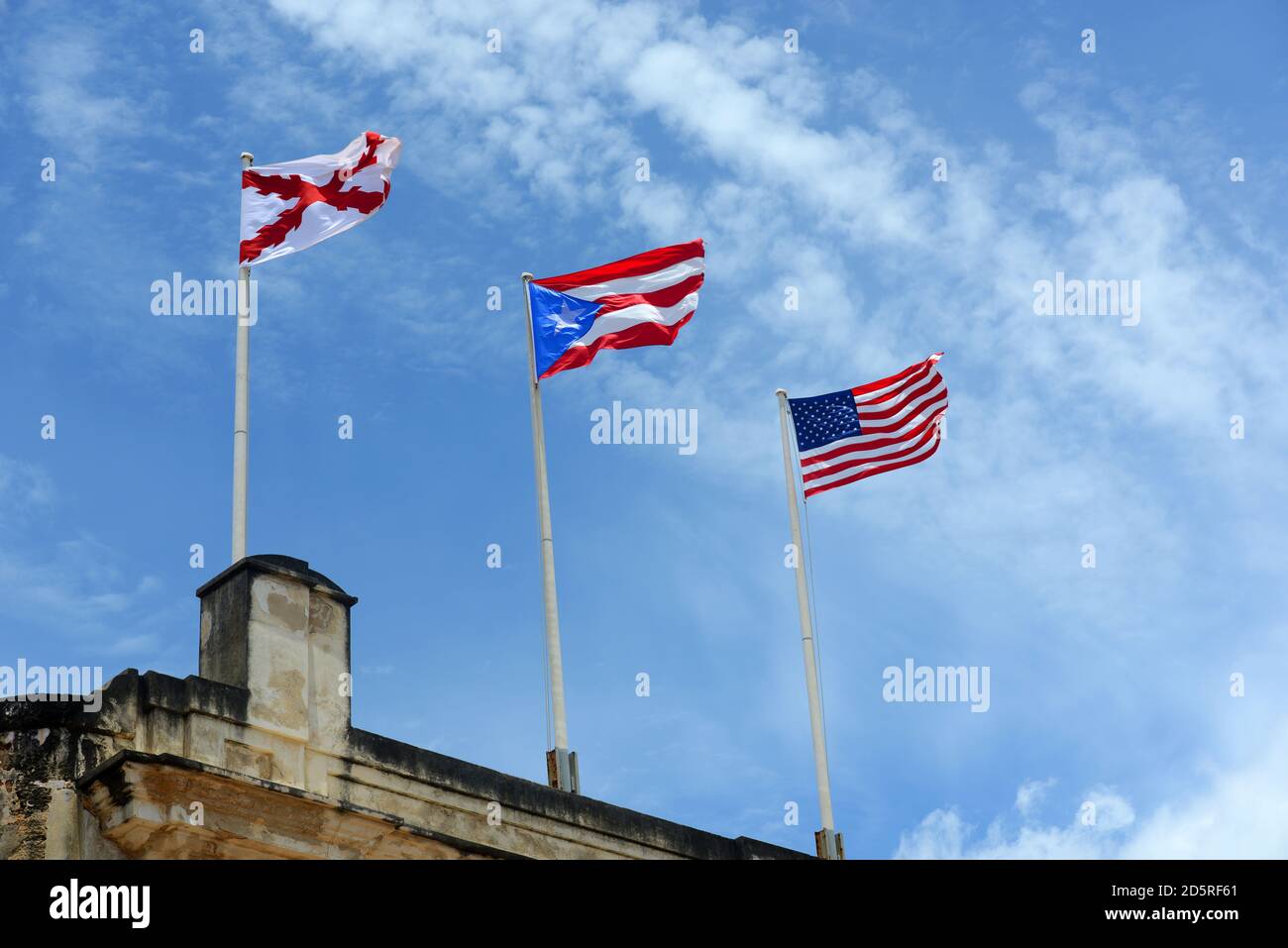 Flags fly at Castillo de San Cristobal, San Juan, Puerto Rico. Three ...