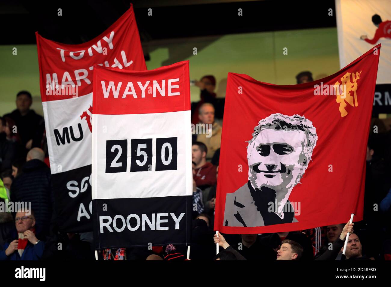 Manchester United fans with banners in the stands Stock Photo - Alamy