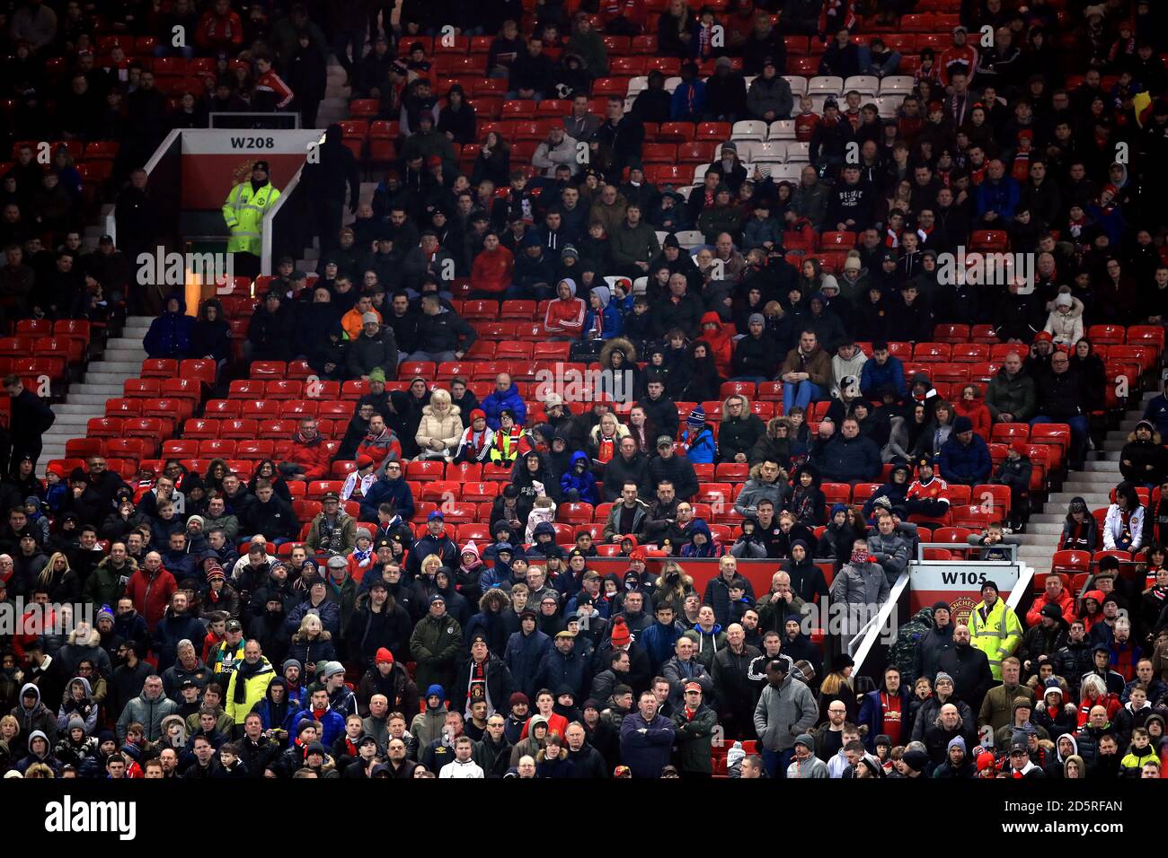 Manchester United fans empty out of their seats before the end of the ...