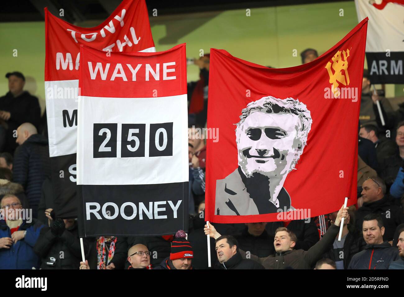Manchester United fans hold banners in the stands Stock Photo - Alamy