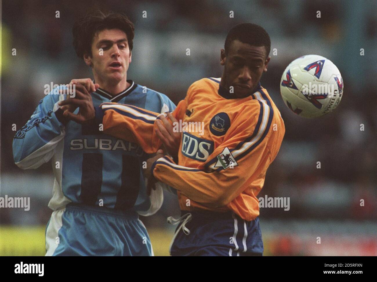 Derby County's Paulo Wanchope and Coventry City's Marc Edworthy in air ...