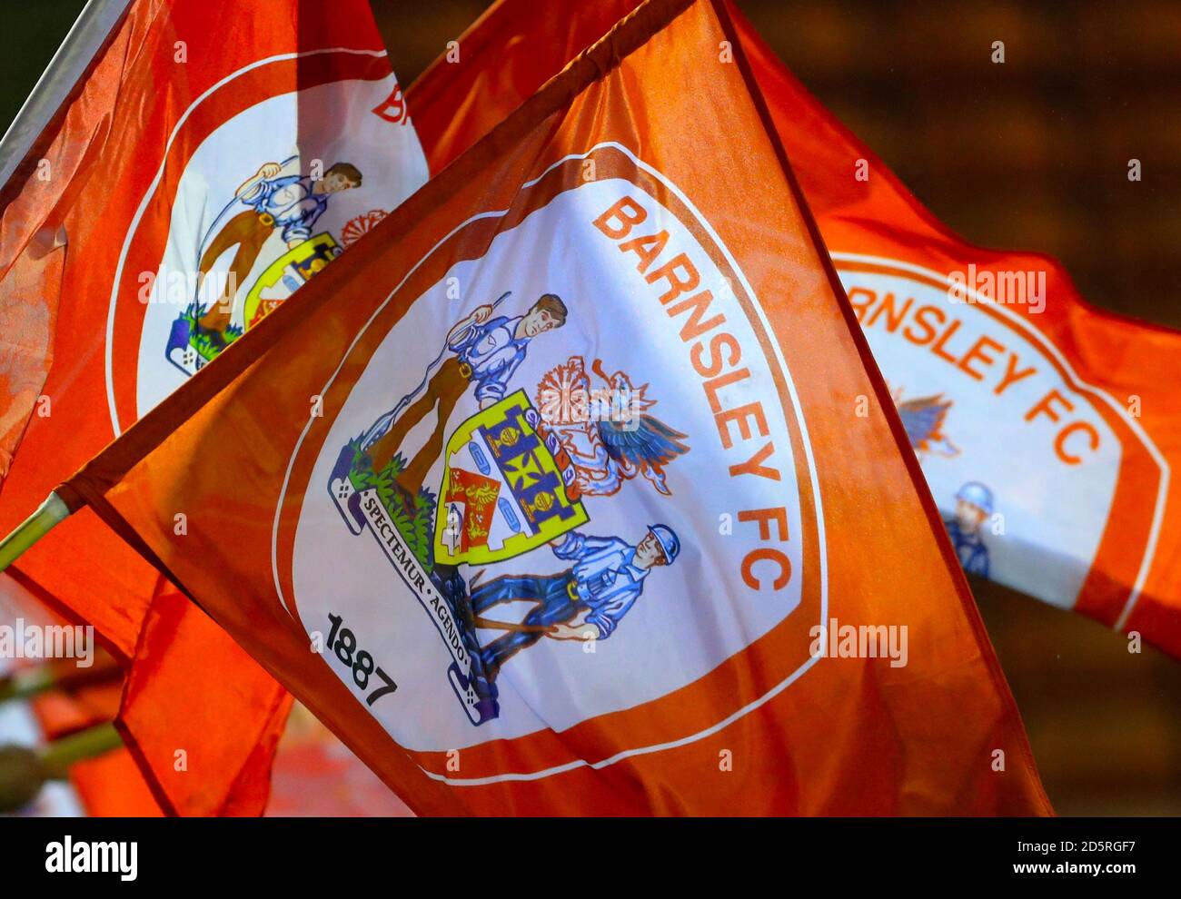 Fans fly Barnsley flags in the stands Stock Photo - Alamy