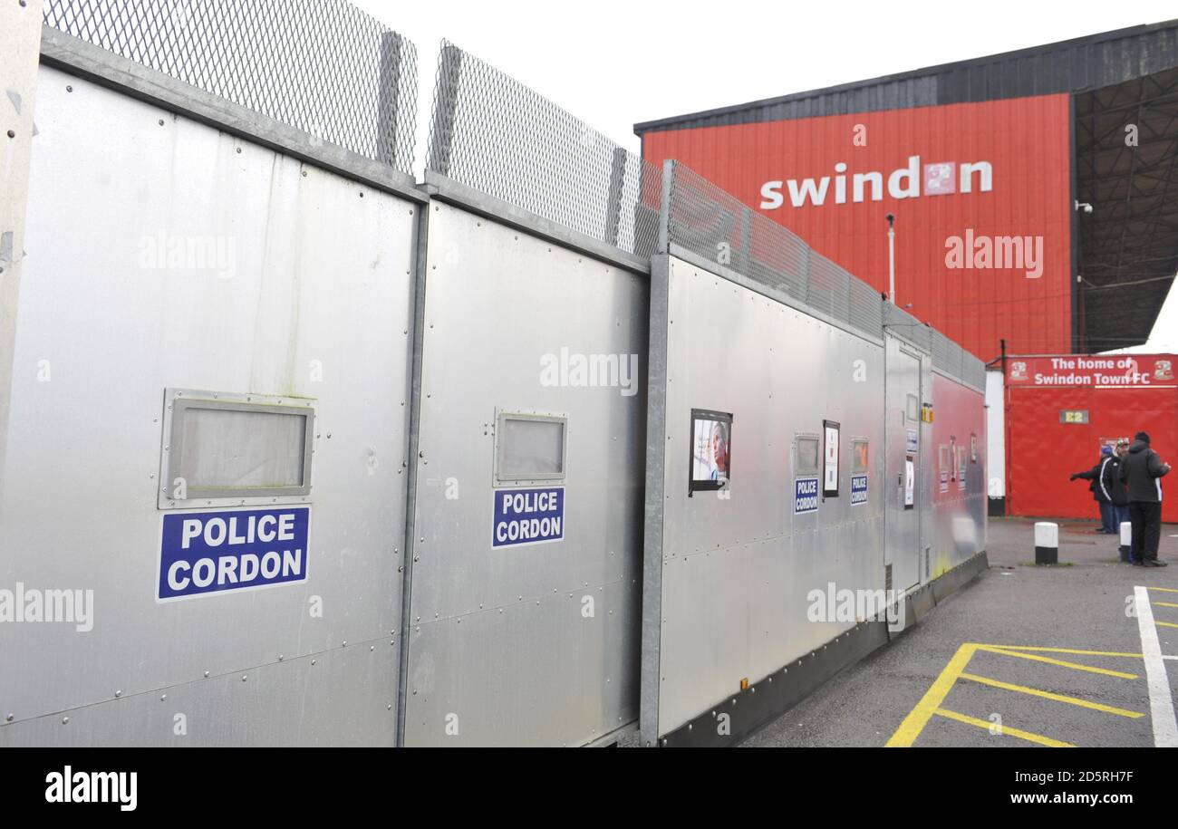 A general view showing a mobile police cordon outside Swindon Town's ...