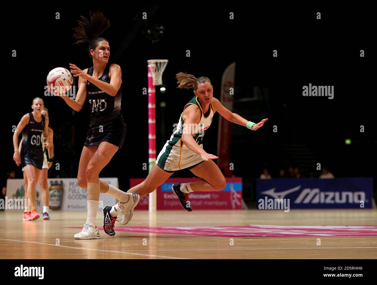New Zealand's Anna Harrison and South Africa Erin Burger going up for ...