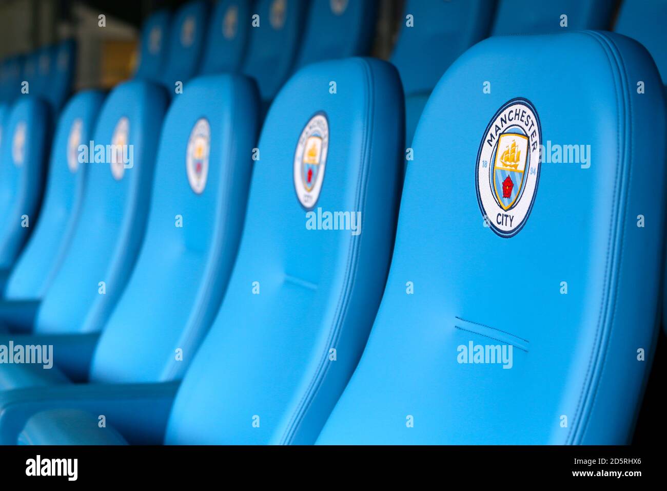 Manchester City branded seating Stock Photo - Alamy