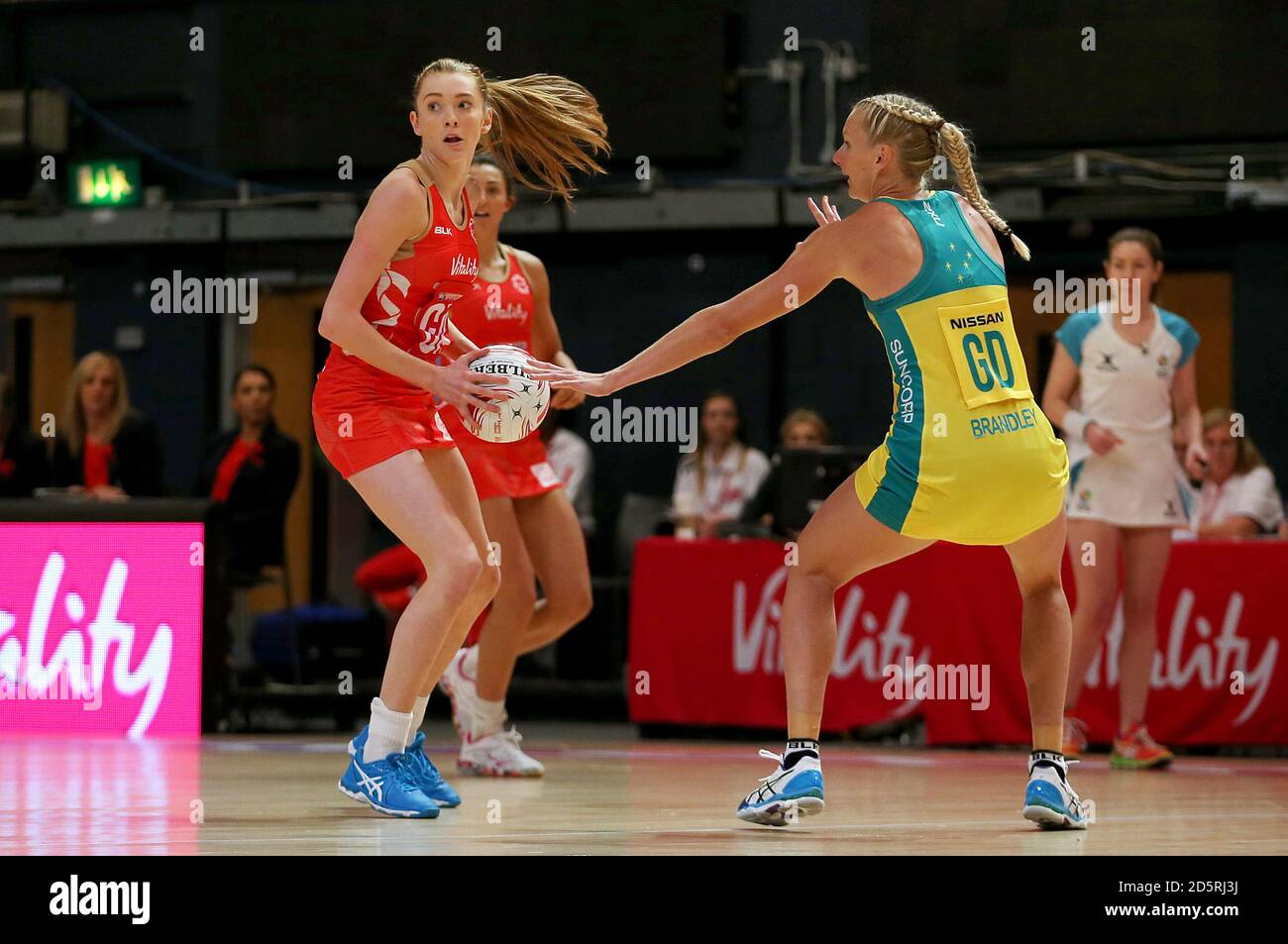England's Helen Housby (left) and Australia's April Brandley in action ...
